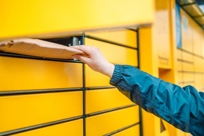Hand with Package. Send or Receive Parcel with Yellow Self Service Post ...