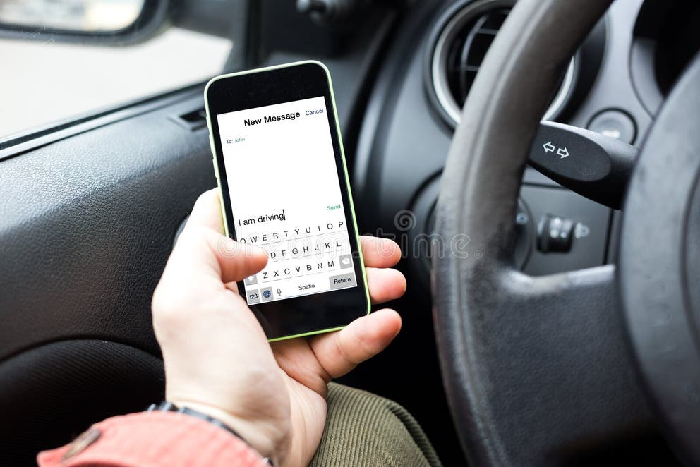 Sending sms while driving stock photo. Image of keyboard - 70198896