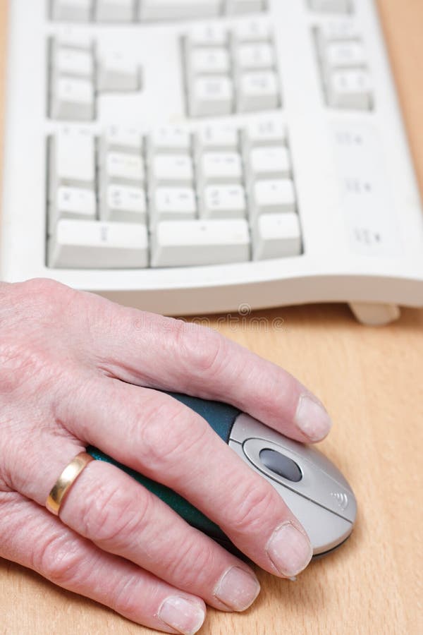 Senior s hand on mouse stock photo. Image of information - 3388254