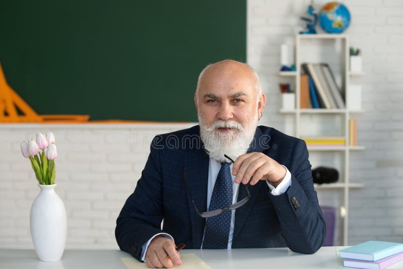Senior Academic Professor Reading and Smoking a Pipe Stock Photo ...