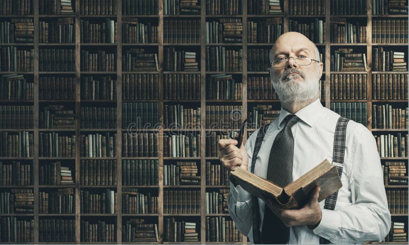 Academic Professor in the Library Holding a Book Stock Photo - Image of ...