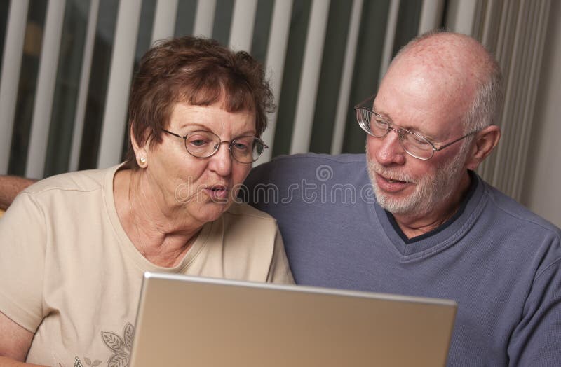 Senior Adult Couple Having Fun on the Computer Stock Photo - Image of ...