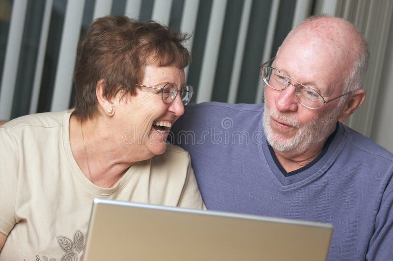 Senior Couple Using Laptop To Shop Online Stock Image - Image of winter ...