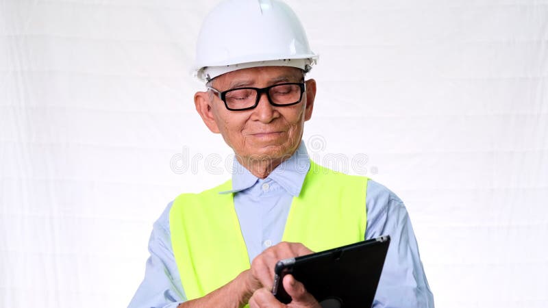 Senior Architect Engineering Builder Wearing Safety Vest and Helmet ...