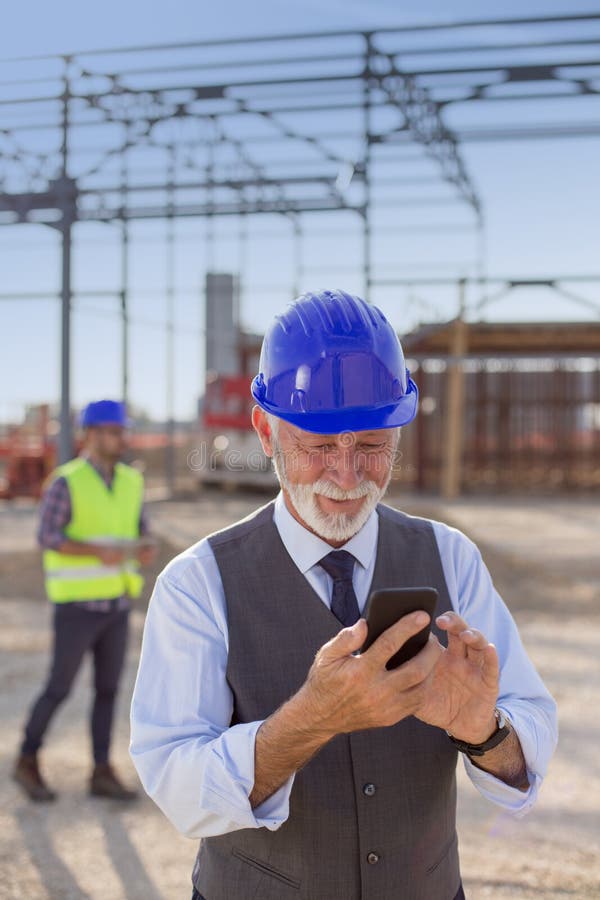 Senior Architect with Phone at Building Site Stock Image - Image of ...