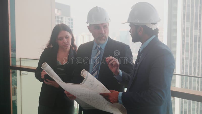 Senior Architect and Secretary Inspector Check Blueprint and Structure ...