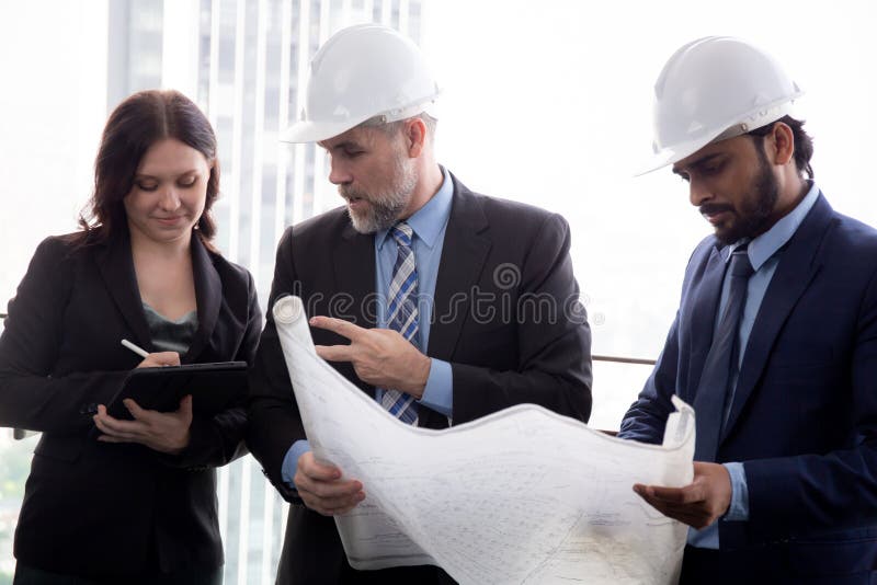 Senior Architect and Secretary Inspector Check Blueprint and Structure ...
