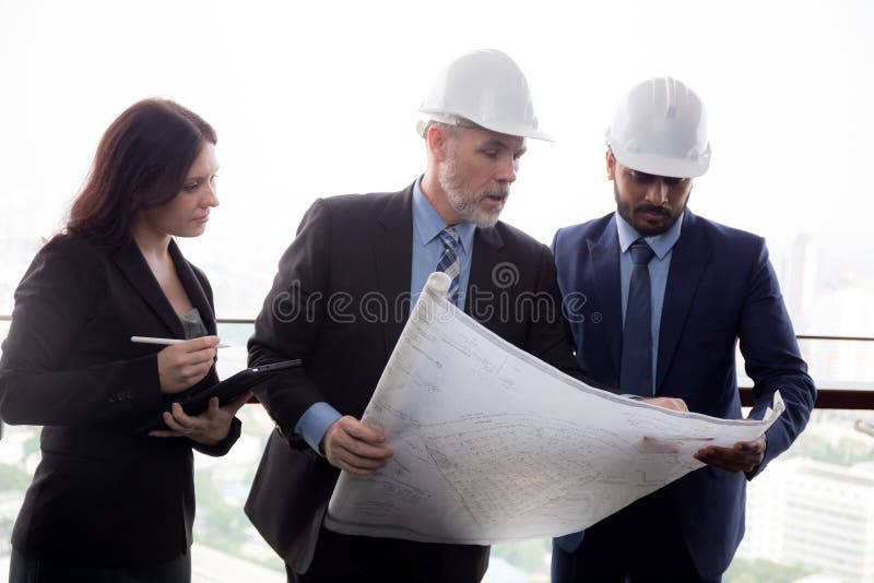 Senior Architect and Secretary Inspector Check Blueprint and Structure ...