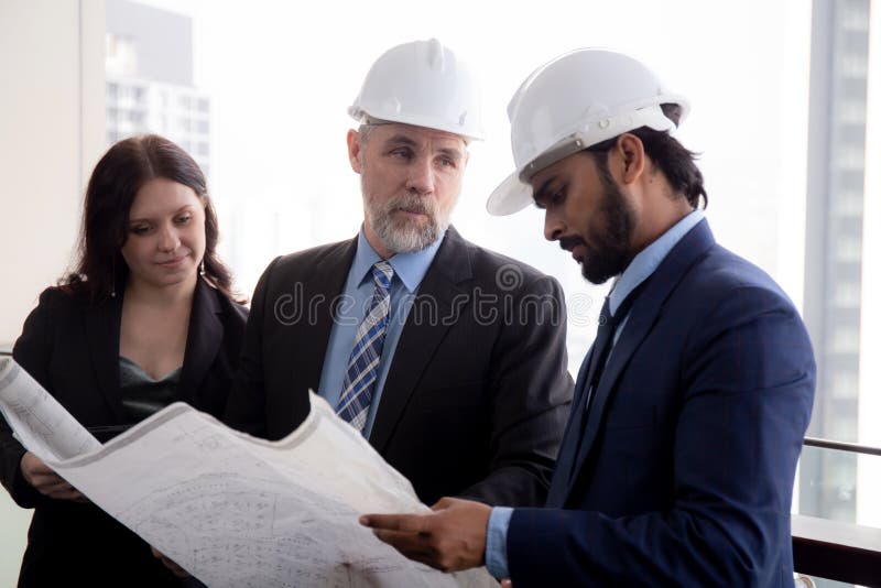 Senior Architect and Secretary Inspector Check Blueprint and Structure ...