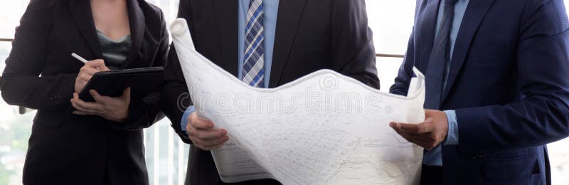 Senior Architect and Secretary Inspector Check Blueprint and Structure ...