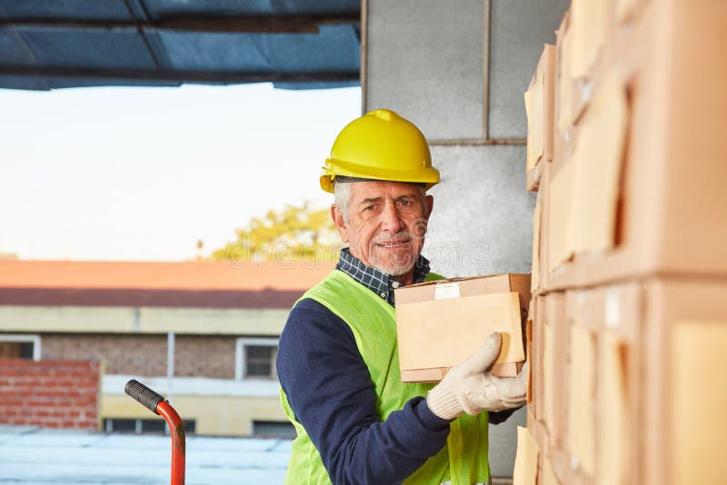 Senior As a Warehouse Worker with a Package Stock Photo - Image of ...