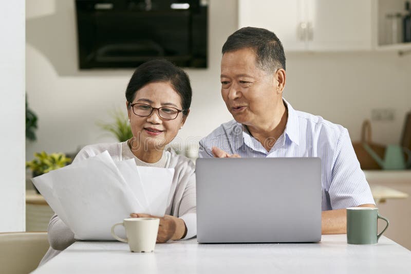 Senior Asian Couple Making Financial Plan Using Laptop Computer Stock ...