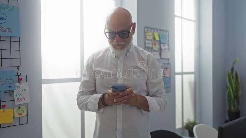 Senior Bald Man with Beard Using Smartphone Inside Modern Office ...