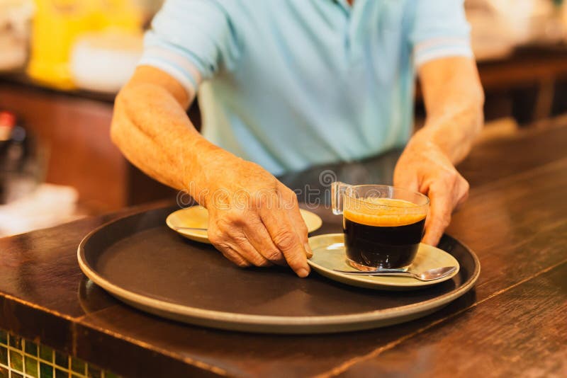 Senior Barista Serving Cup of Coffee during Breakfast Time. Stock Image ...