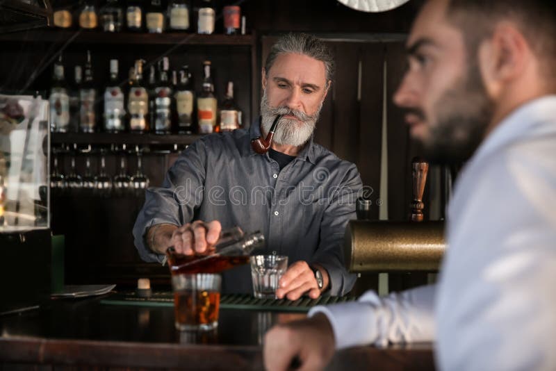 Senior Barman Serving Client in Pub Stock Image - Image of liquor ...