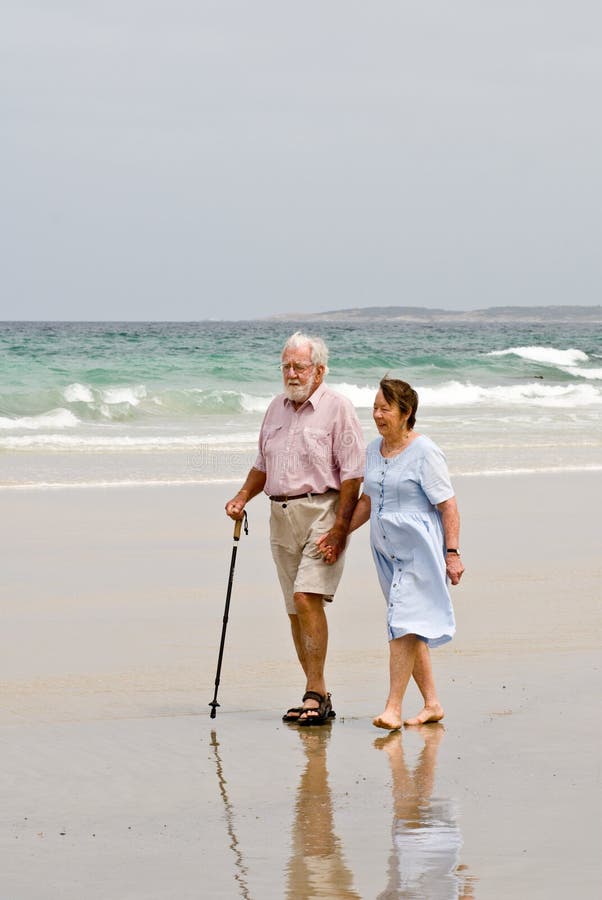 An Old Person on the Beach editorial photo. Image of walking - 590721