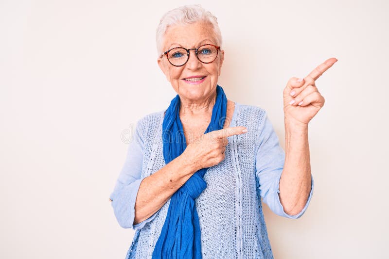 Senior Beautiful Woman With Blue Eyes And Grey Hair Wearing Casual