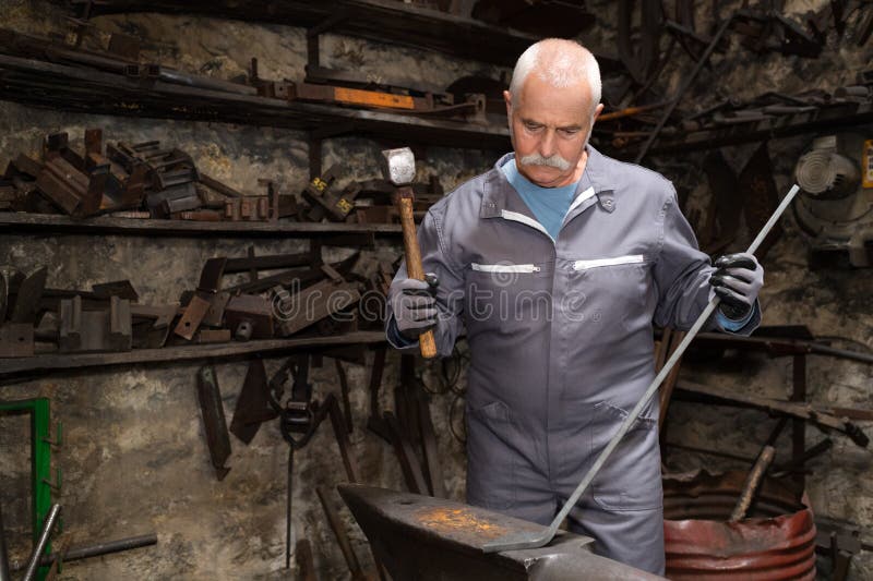 Senior Blacksmith Forging Metal Stock Photo - Image of adult, activity ...