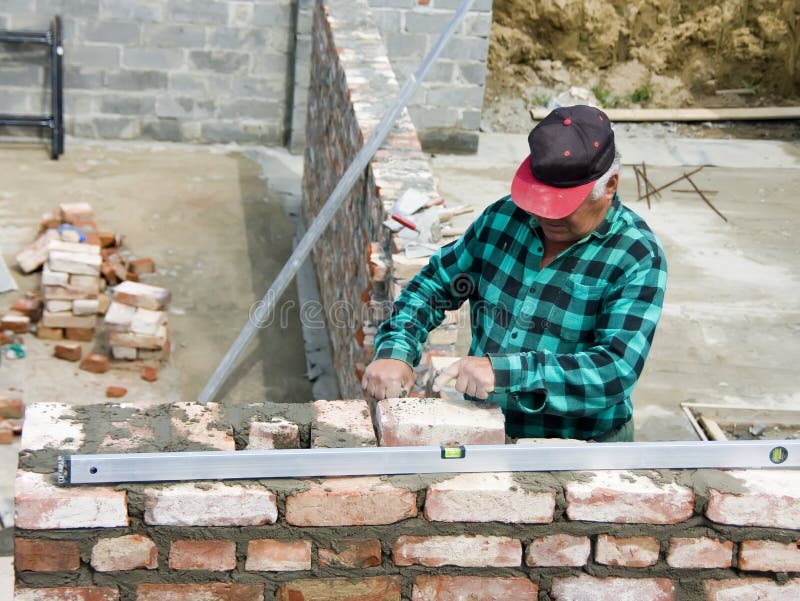 Bricklayer at work stock image. Image of adult, laying - 5464257