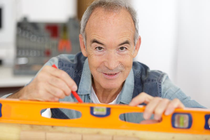 Senior Builder Man with Level Stock Photo - Image of industry, measure ...