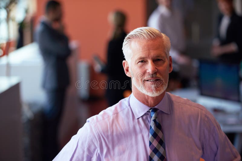 Senior Business Man with His Team at Office Stock Photo - Image of ...
