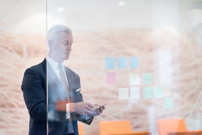 Senior Business Man Making Plans with Sticker Stock Photo - Image of ...