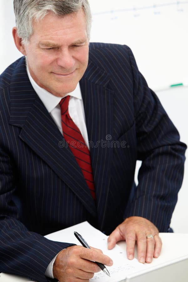 Senior Business Man Taking Notes in Office Stock Image - Image of ...