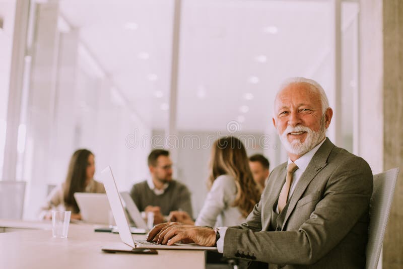 Senior Business Man Working on Digital Tablet in the Office Stock Photo ...