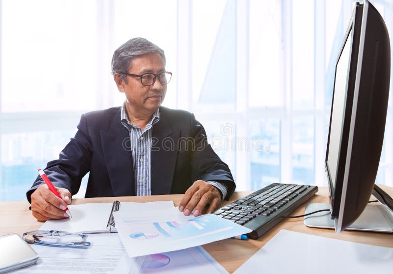Senior Business Man Working on Office Tabel with Computer and Bu Stock ...