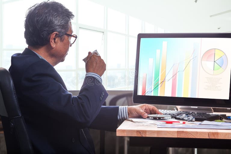 Senior Business Man Working on Office Table with Computer and Bu Stock ...