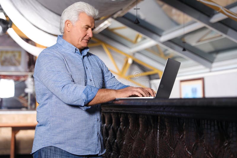 Senior Business Owner Working with Laptop in Restaurant Stock Image ...