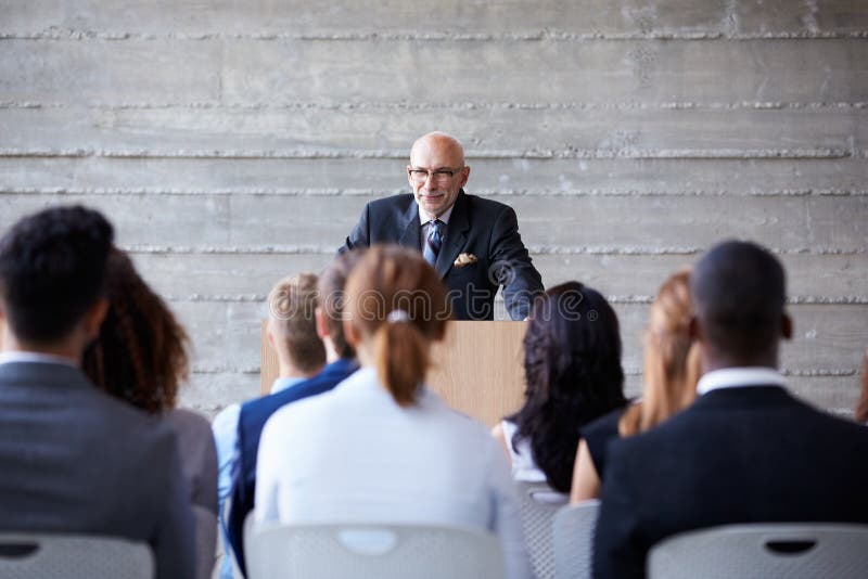 Senior Businessman Addressing Delegates at Conference Stock Photo ...
