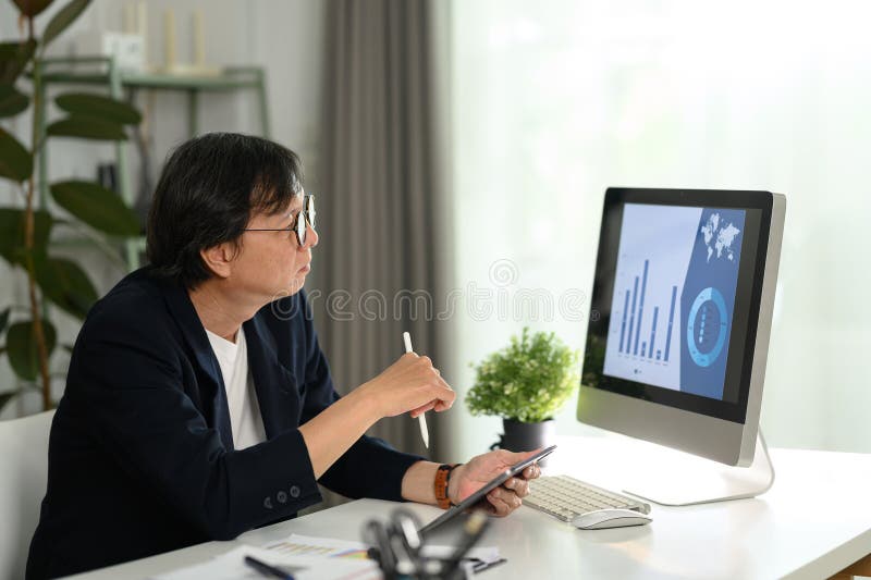 Senior Businessman Analyzing Statistics Data on Computer Monitor Stock ... Senior Businessman Analyzing Statistics Data on Computer Monitor Stock ...