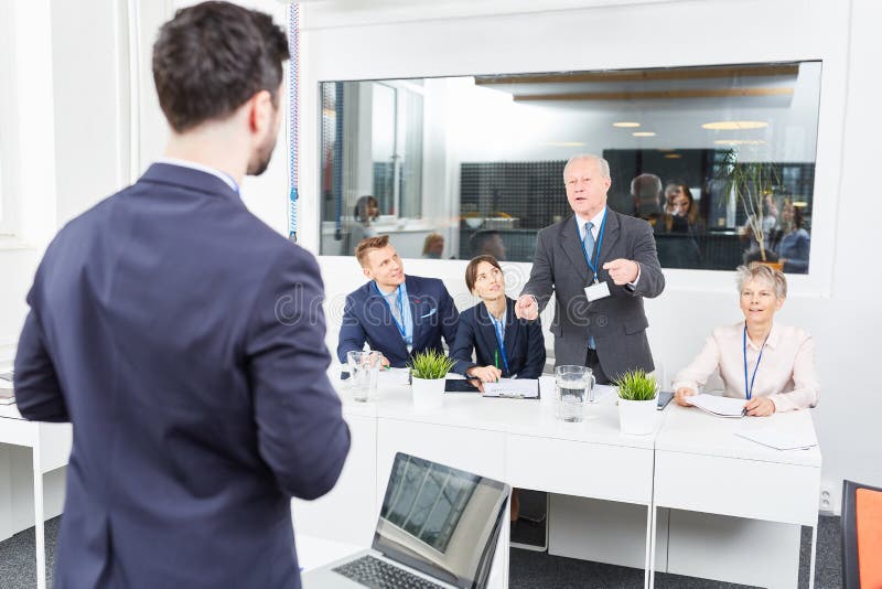 Senior Businessman in Discussion at Workshop Stock Image - Image of ...