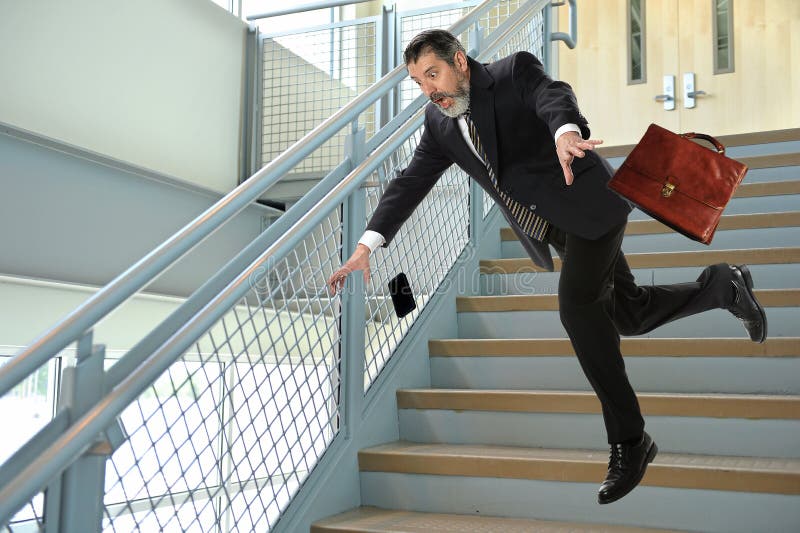 Senior Businessman Falling on Stairs Stock Image - Image of cellphone ...