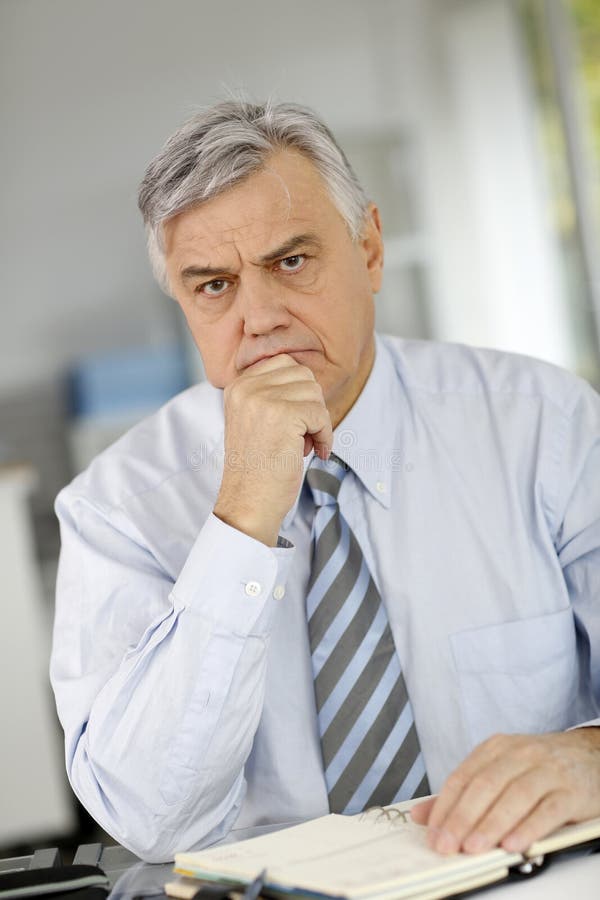 Senior Businessman at Office Being Serious Stock Image - Image of ...