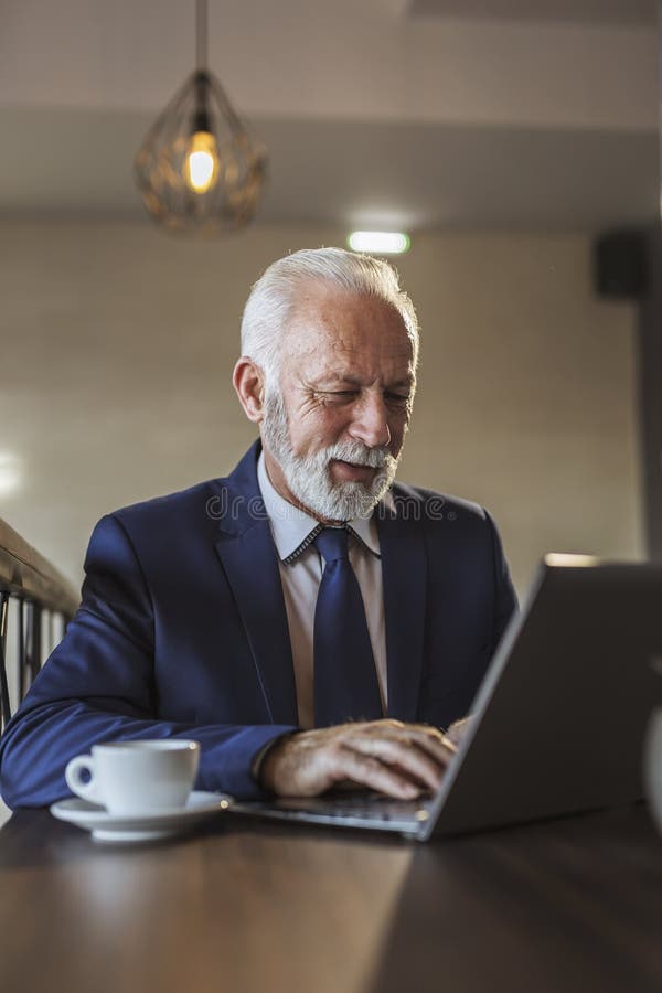 Senior Businessman Sending an Email Using Laptop Computer Stock Photo ... Senior Businessman Sending an Email Using Laptop Computer Stock Photo ...
