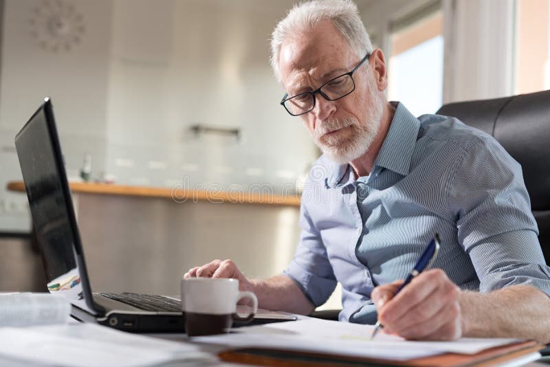 Senior Businessman Taking Notes, Hard Light Stock Image - Image of ...