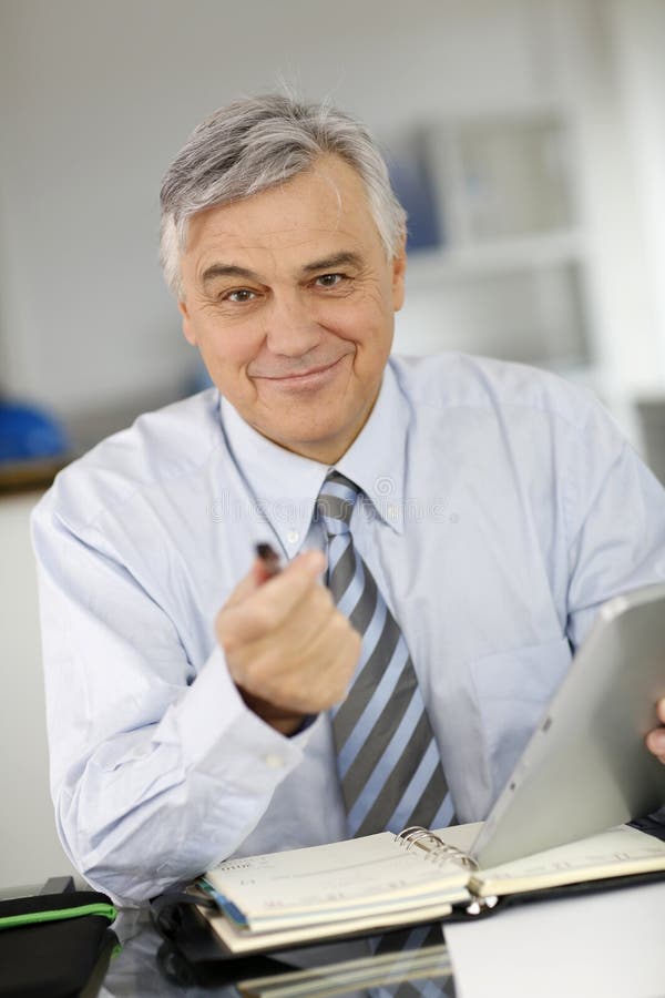 Senior Businessman Talking To Client Stock Image - Image of businessman ...