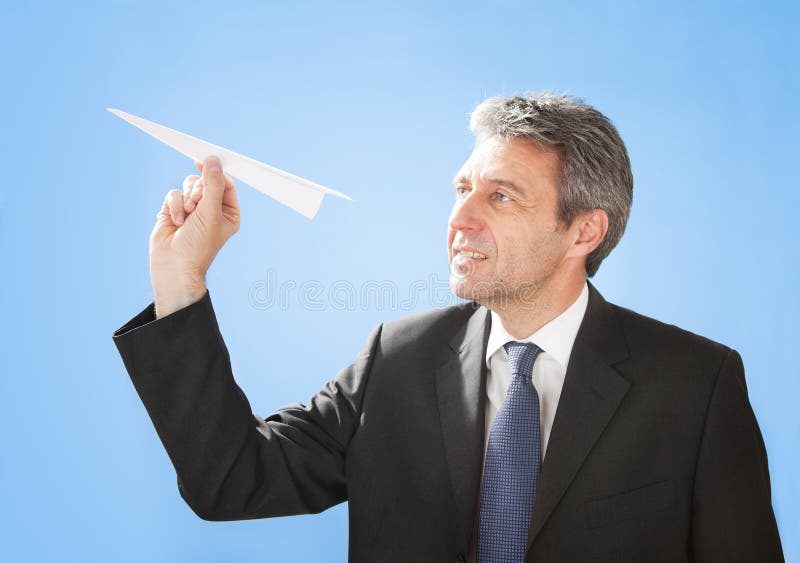 Senior Businessman Throwing a Paper Plane Stock Image - Image of ...