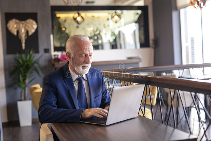 Senior Businessman Typing a Report Stock Photo - Image of entrepreneur ...