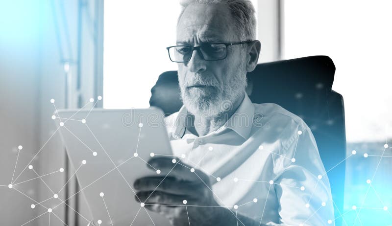 Senior Businessman Using a Digital Tablet; Light Effect Stock Photo ...