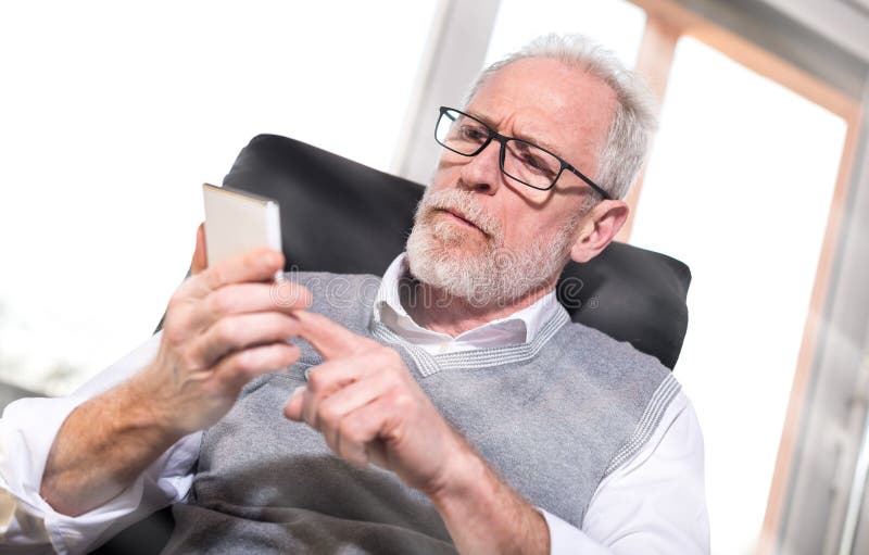 Senior Businessman Using His Mobile Phone, Light Effect Stock Photo ...