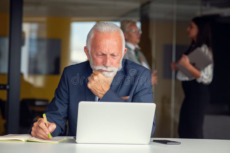 Senior Businessman Working on Laptop Computer in Modern Office Stock ...