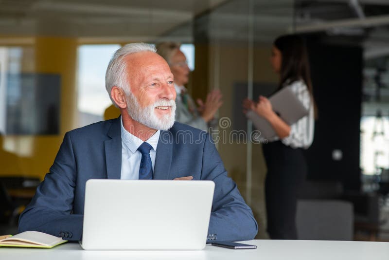 Senior Businessman Working on Laptop Computer in Modern Office Stock ...