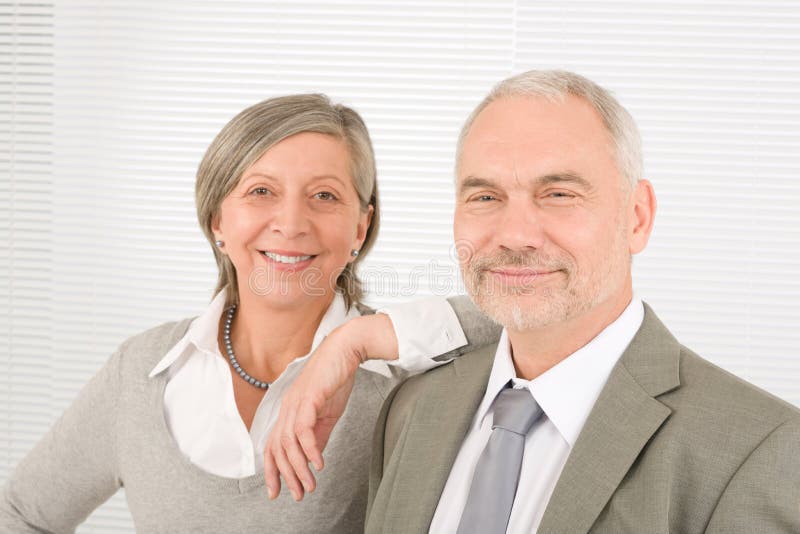 Senior Businesspeople Lean Over Shoulder Colleague Stock Image - Image ...