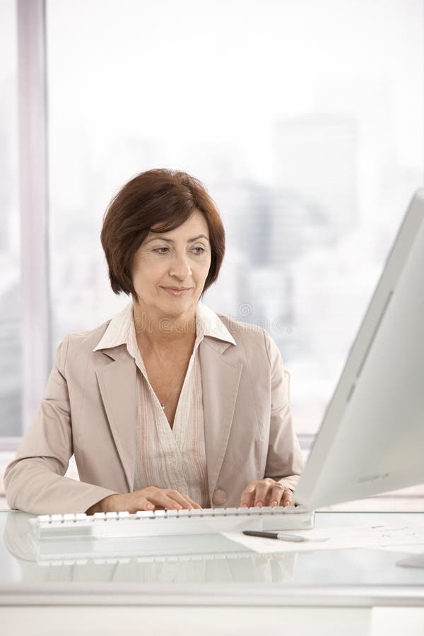 Senior Businesswoman Working on Computer Stock Image - Image of busy ...