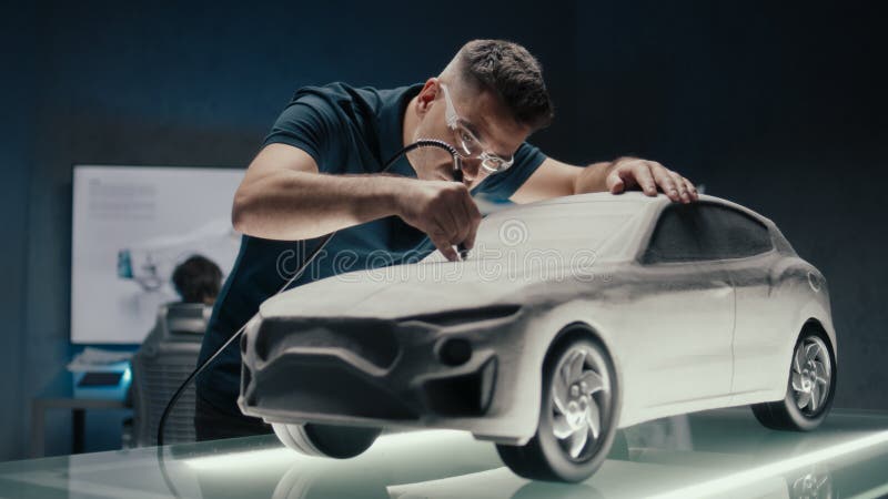 Senior Car Designer Works on Prototype Car Clay Sculpture Using a ...
