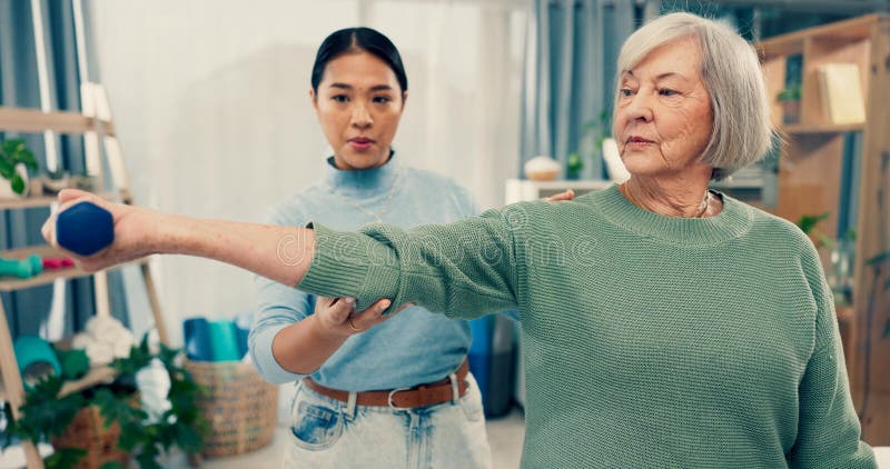 Senior Care Therapy And Physiotherapist With Old Woman Dumbbell And