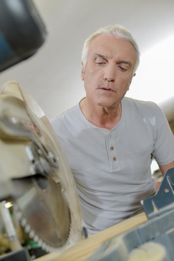 Senior Carpenter Using Circular Saw Stock Image - Image of dwelling ...